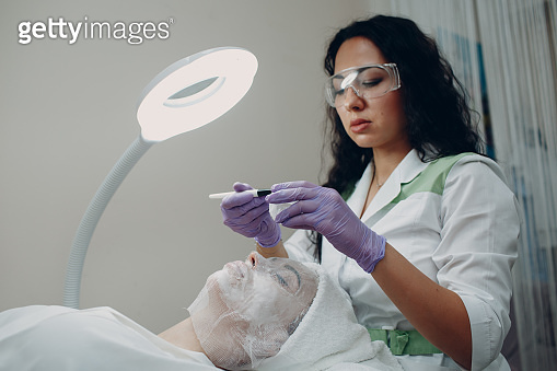 Paraffin Face Mask gauze bandage Therapy Young Woman Receiving Facial ...
