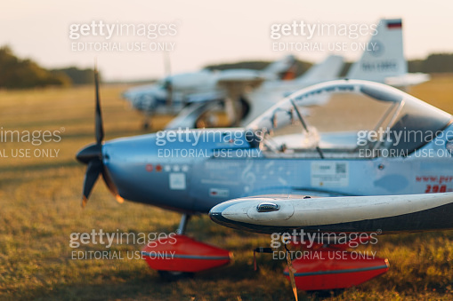 Small private single engine propeller airplane at sunset regional ...