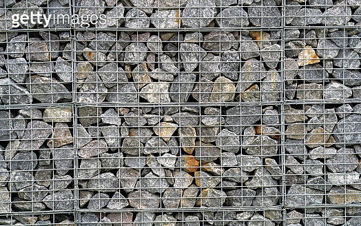 Wire Gabion Rock Fence. Stone wall texture, rocks behind metal grid ...