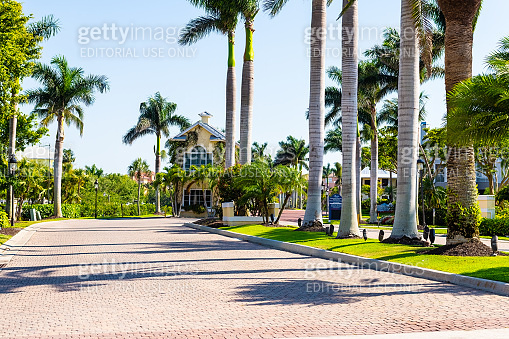 Florida town in Collier county with sign for entrance to Barefoot Beach ...