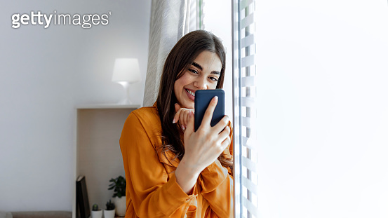Smiling young brown hair woman posing for a selfie inside the office ...
