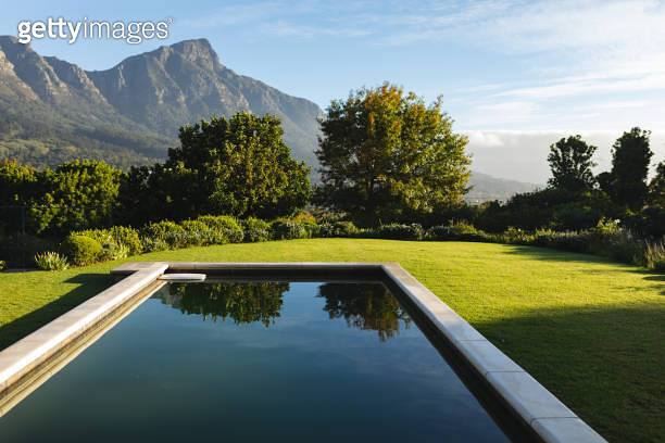 General view of tranquil swimming pool in stunning mountains ...