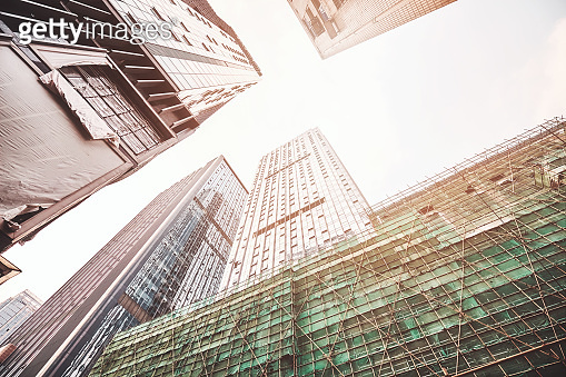 Looking up at skyscrapers in downtown Chengdu, color toned picture ...