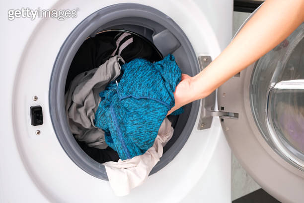 Woman's hand Pick up clothes Washing machine.Clean and Healthy Concepts ...