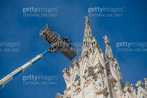 Technicians on lifting platform for scheduled maintenance plan and study of the degradation ...