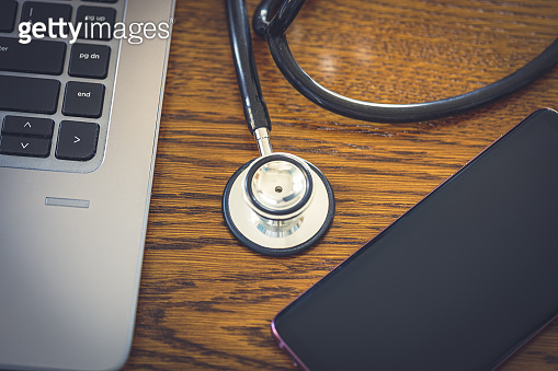 Telemedicine, remote advice and diagnose, laptop, mobile phone and ...