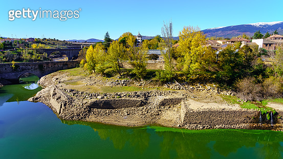 Lozoya River as it passes through the medieval city of Buitrago de ...