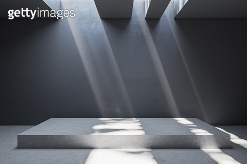 Dark grey concrete exhibition room interior with podium and empty ...