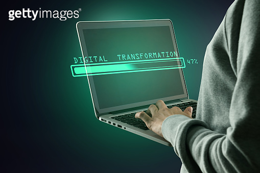 Hacker using laptop computer with abstract glowing loading bar on gray ...