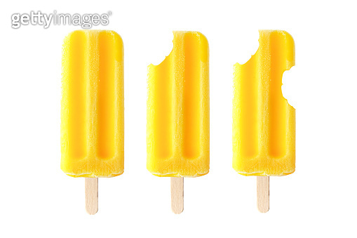 Yellow ice pops with increasing number of bites removed isolated on ...