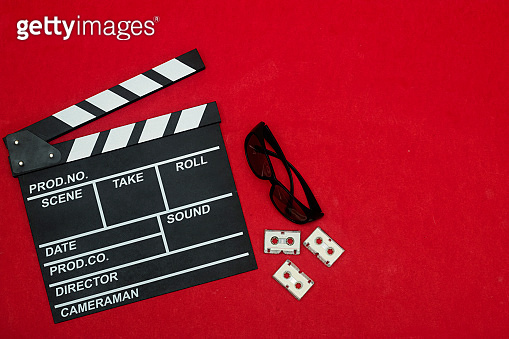 clapper board of video cinema and audio tape cassette and glasses in ...