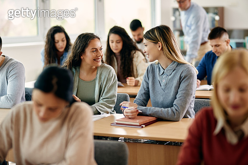 Happy female students talking during a class at the university. 이미지 ...