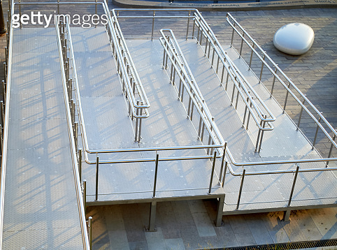 A long zigzag ramp for strollers and wheelchairs. Amenities for people ...