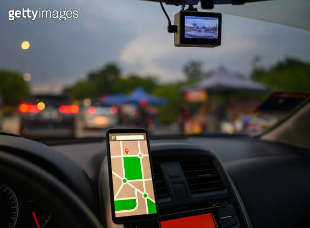 Driver using maps app for showing the right route through the traffic ...
