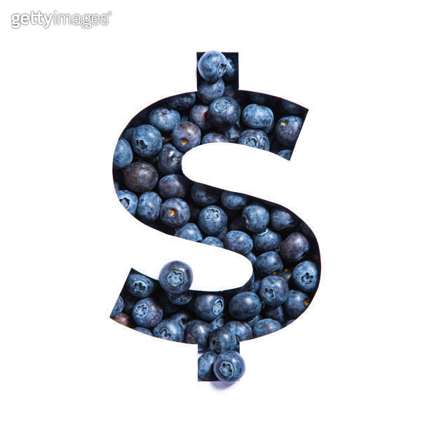 Dollar money sign made of blueberries and cut paper isolated on white ...