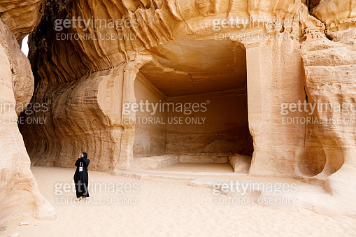 Tourist inside the Siq of Jabal Ithlib in Al Ula, Saudi Arabia ...