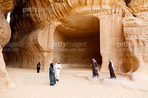 Tourist inside the Siq of Jabal Ithlib in Al Ula, Saudi Arabia ...