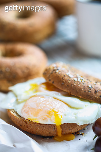 Fresh healthy everything bagel sandwich with sunny side up runny fried ...