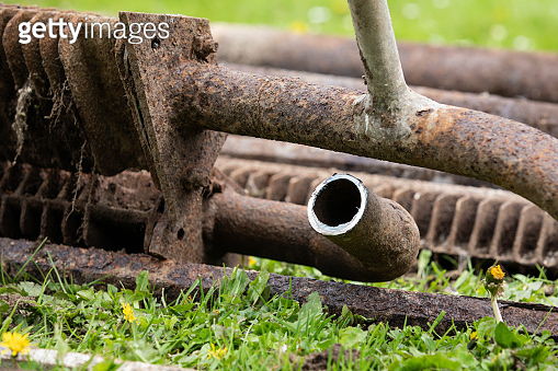 Rusty pipes and heating radiators. Metal collection and distribution ...