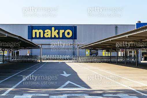 Logo and facade of Makro, a chain of self-service wholesales stores ...