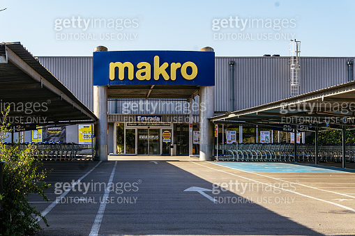 Logo and facade of Makro, a chain of self-service wholesales stores ...
