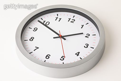 Large white clock, black numbers, red needle Set a timer on the white ...