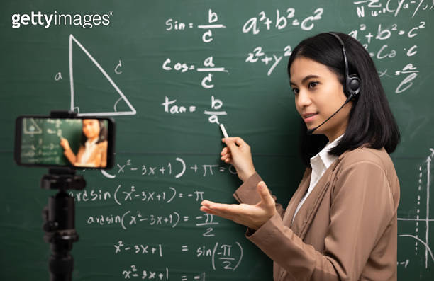 Young asian teacher woman standing looking at camera and video ...