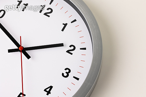 Large white clock, black numbers, red needle Set a timer on the white ...