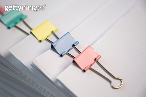 Piles of white papers work large piles of papers stacked together. On ...