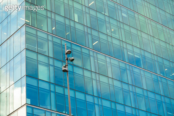 Close view of large glass building with cameras. (1350337559) - 게티이미지뱅크