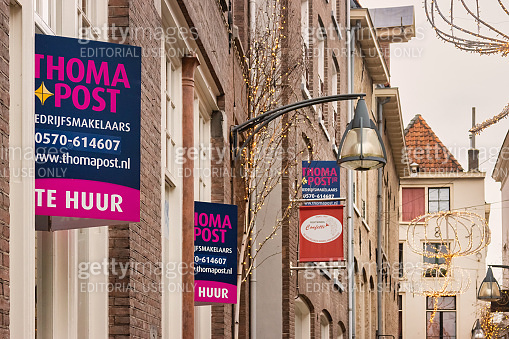 Empty stores with Dutch for rent signs in the historic city center of ...
