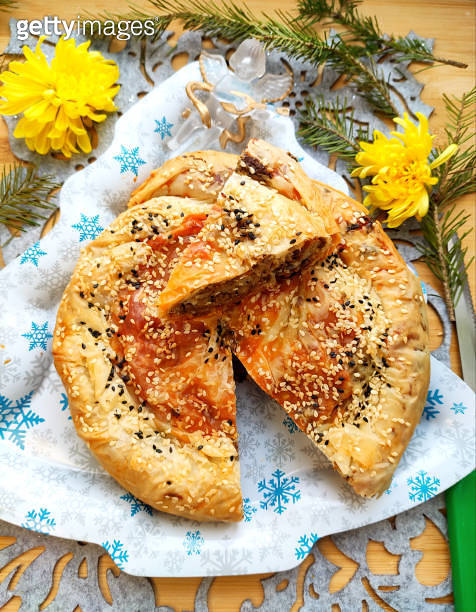 Traditional Greek pie made of puff pastry, minced meat, cheese and ...