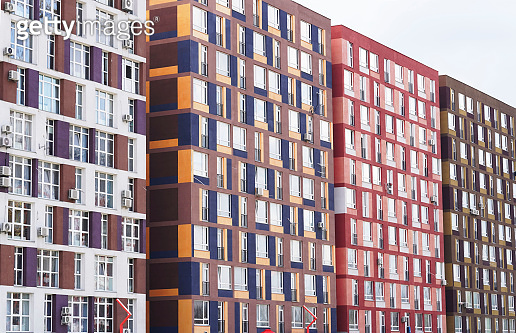 Architectural texture - four colorful multi-storey buildings with many ...