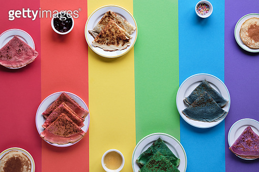 Rainbow pancakes, different color crepes. Spinach, beetroot powder ...