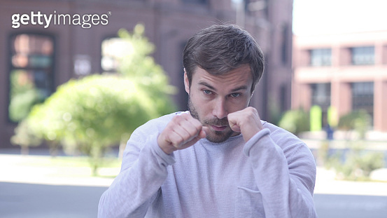 Fighting Gesture by Aggressive Handsome Man Standing Outdoor 이미지 ...