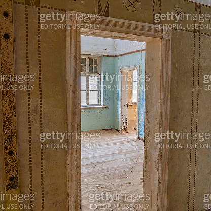 View in a room at German Kolmanskop Ghost Town with the abandoned ...