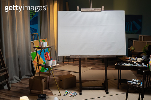 A workspace, a studio of a painter, an artist with a large easel with a ...