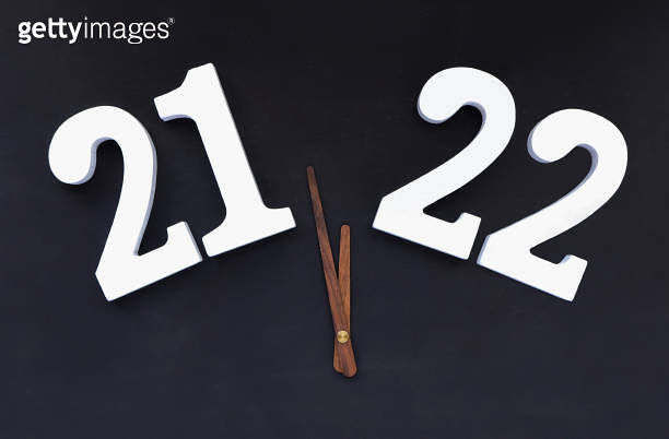 Number white wood 21 ,22 and wood clockwise on black background. Happy ...