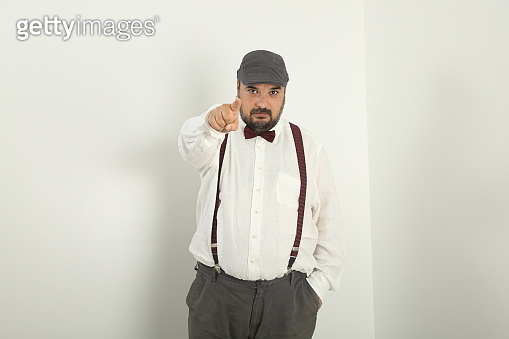 young man making gestures with his hands and face, hand sign you ...