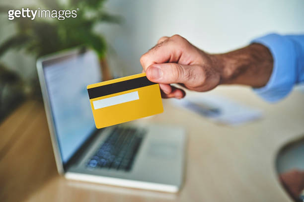 Shot of an unrecognizable businessman sitting alone in his office and ...