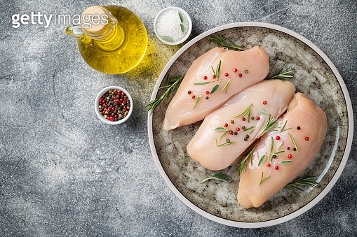 Raw meat of chicken breasts for healthy food diet on grey concrete ...