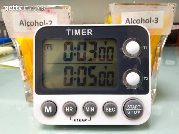 Closeup stop watch in laboratory. Timer. Laboratory test time counting ...