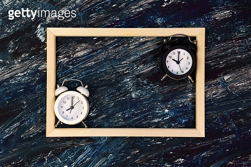 alarm clocks on a dark background with a space under the text. good ...
