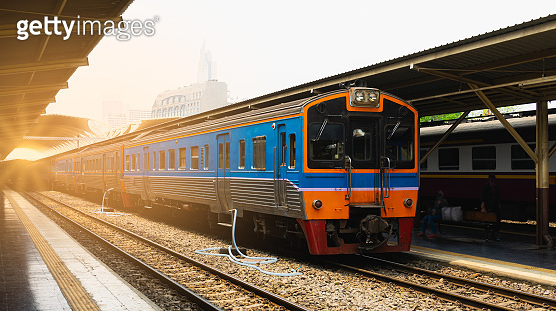 closeup old iron train on steel track in train station with sunlight ...