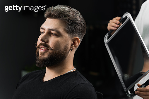 Barber with dreadlocks showing result of low fade machine hair and ...
