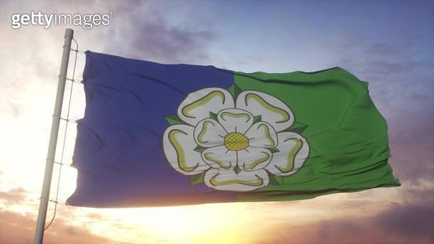 East Riding of Yorkshire flag, England, waving in the wind, sky and sun ...