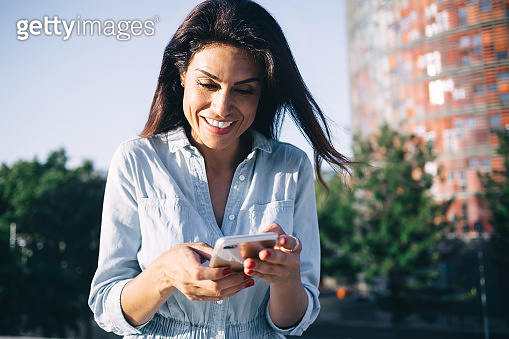 Smiling caucasian woman 30w happy about victory in online contest using ...