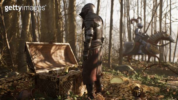 An ancient knight opens an old treasure chest with gold coins. Knights ...