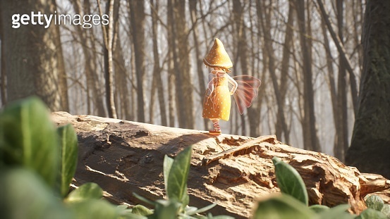 A cute little elf is resting and walking in the summer sunny green ...