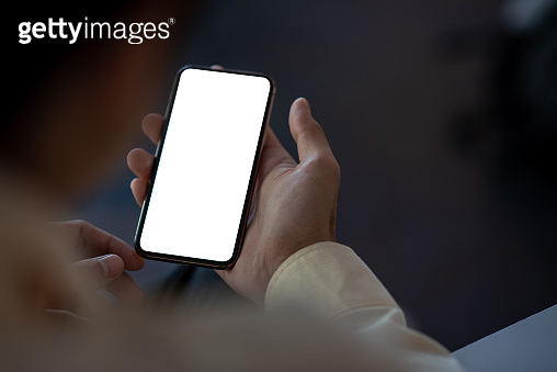 Close up. businessman holding mobile phone white blank smartphone ...